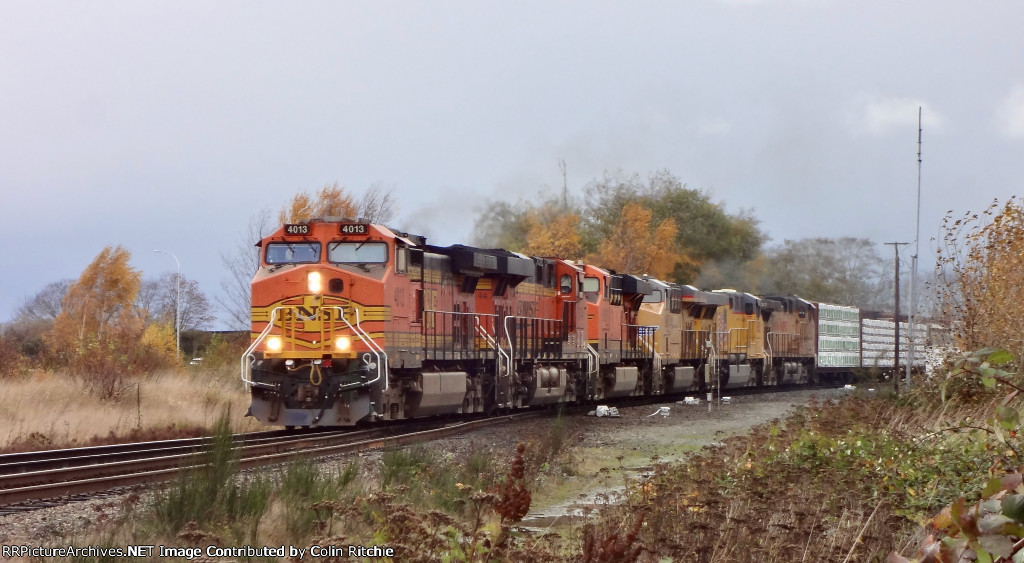 BNSF 4013/8144/6109 and UP 8167/6935/6537 E/B through Mud Bay West with a long mixed freight ...